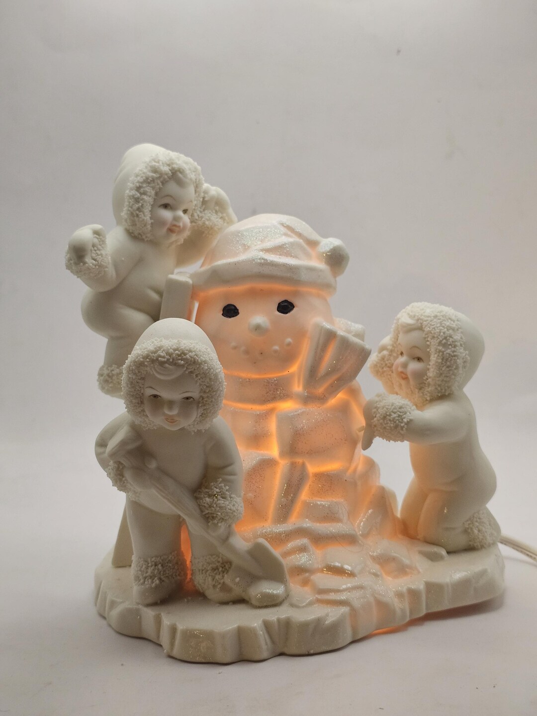 Vintage Figurine Featuring Three Snowbabies Building A Lighted Snowman ...