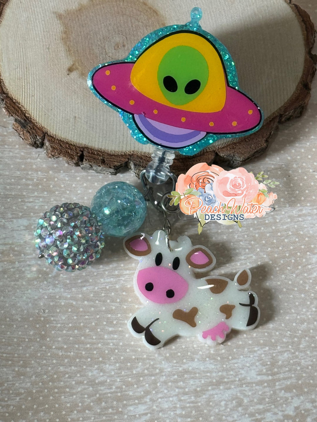 Alien Pulling up a Cow Charm With Beads Badge Reel Spaceship Rocket - Etsy