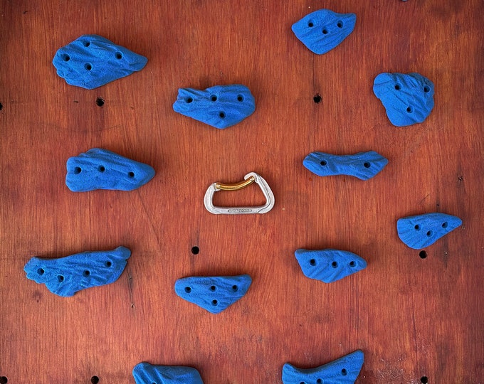 Mini Rock Climbing Wall: Rainbow Colored Rocks on a Small Climbing Wall ...