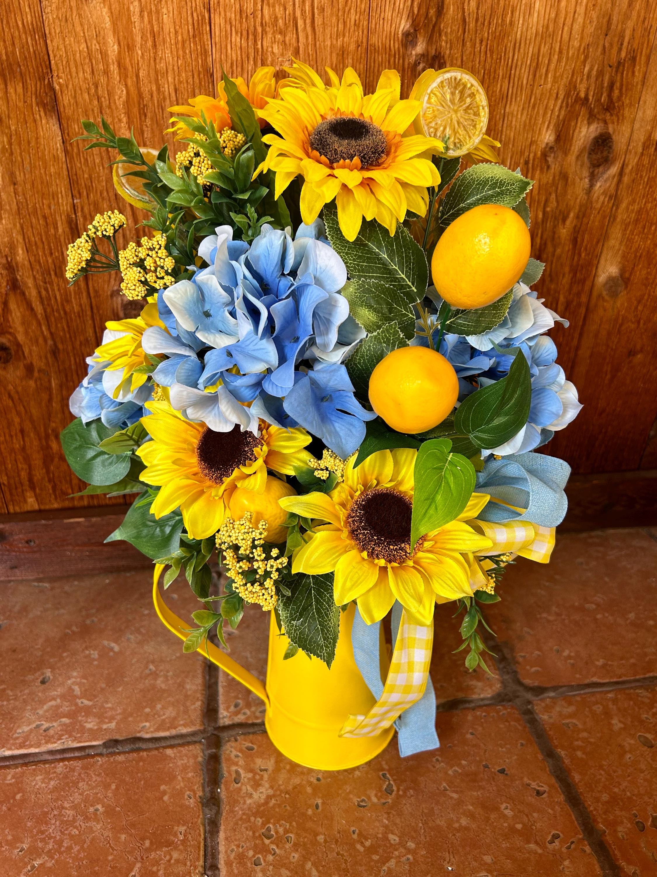 Blue Vase And Sunflower Centerpiece