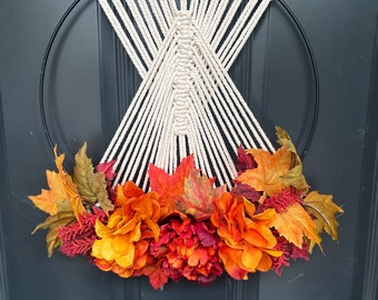 A Double Raffia Door Wreath With Wood Flowers & Many Accents Resembling ...