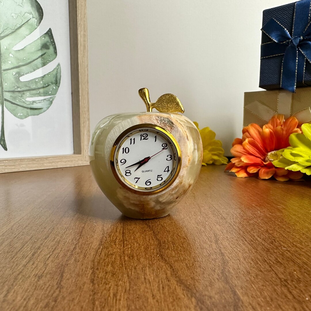 Timeless Elegance: Marble Apple Desk Clock With a Golden Stem and a ...