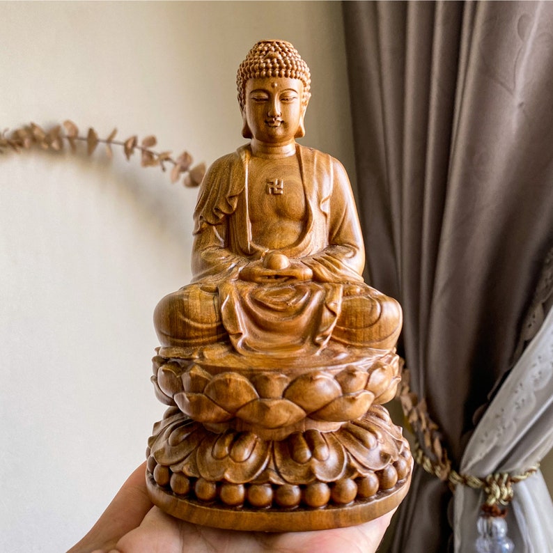 What does the ball mean when an Amitabha Buddha statue is holding one ...