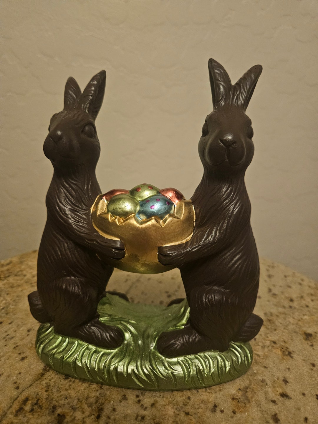 Two Faux Chocolate Easter Bunnies Rabbits Carrying a Foil Wrapped Egg ...