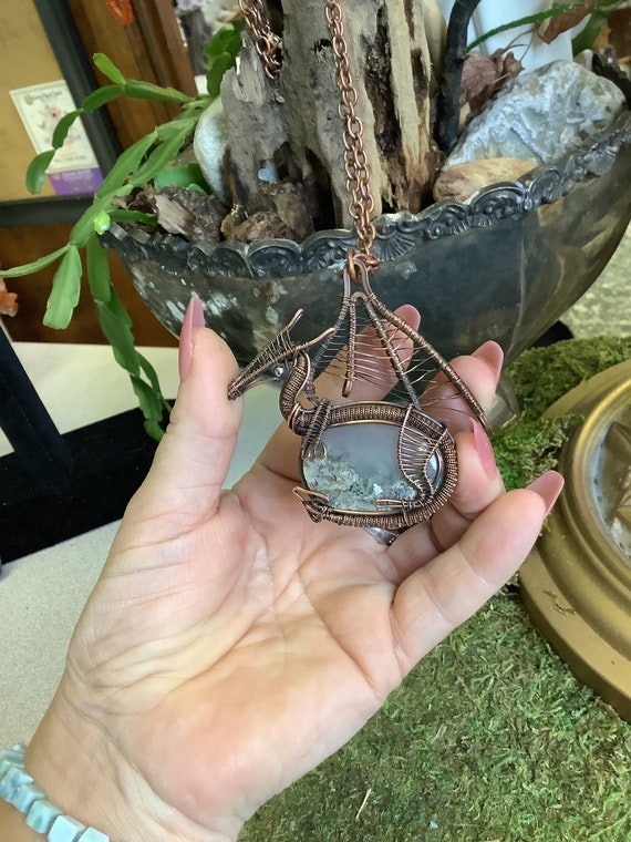 Hand warped in copper Dragon guarding Moss agate drag… - Gem