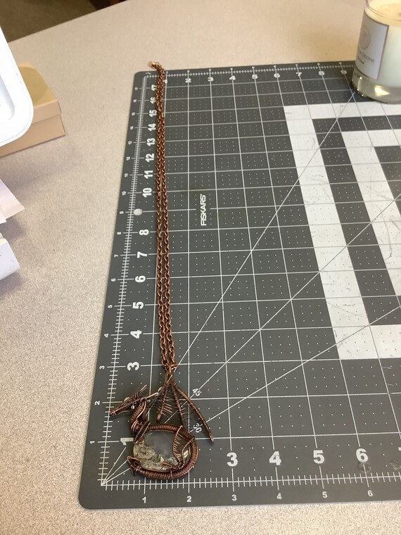 Hand warped in copper Dragon guarding Moss agate drag… - Gem