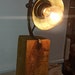 A Table Lamp or Work Lamp Made of Copper Material on Wood is a ...