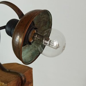 A Table Lamp or Work Lamp Made of Copper Material on Wood is a ...