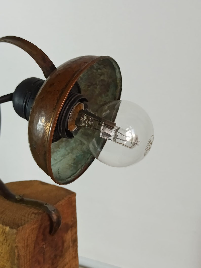 A Table Lamp or Work Lamp Made of Copper Material on Wood is a ...