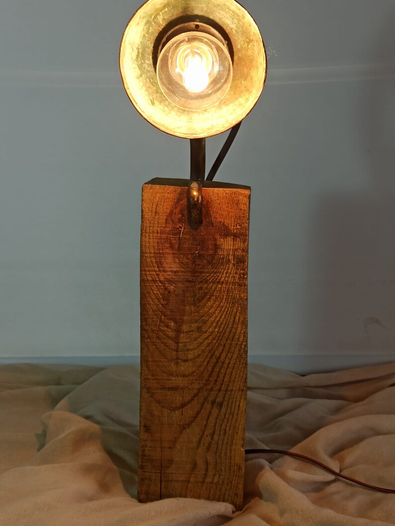 A Table Lamp or Work Lamp Made of Copper Material on Wood is a ...