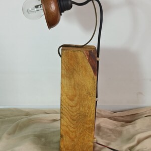 A Table Lamp or Work Lamp Made of Copper Material on Wood is a ...