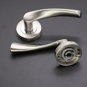 Pair of Twisted Lever on Sprung Rose Dual Tone Finish Door Pull Handles ...