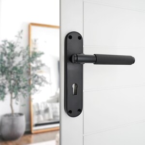 Pair of Knurled Lever Lock Door Handles on Keyhole Backplate Set in ...
