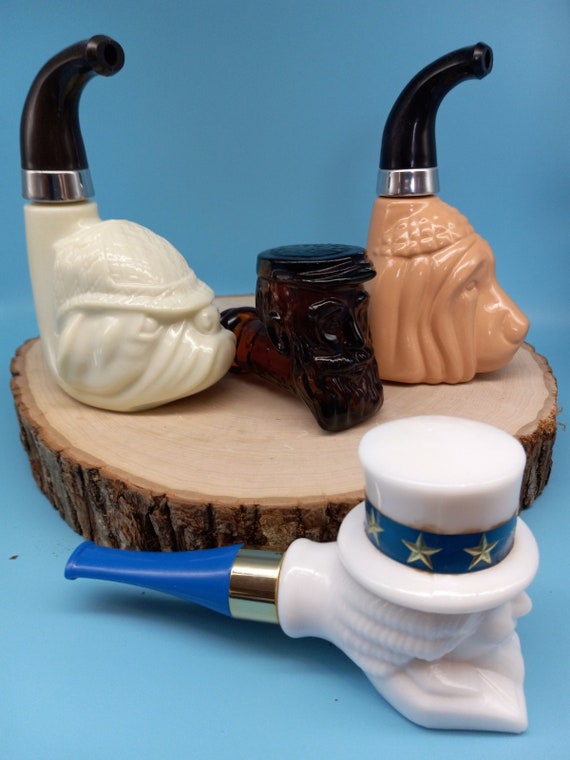 Set of 4 1970's Avon Pipe Bottles. 3 are full of colo… - Gem