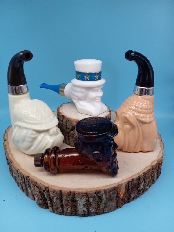 Set of 4 1970's Avon Pipe Bottles. 3 are full of colo… - Gem