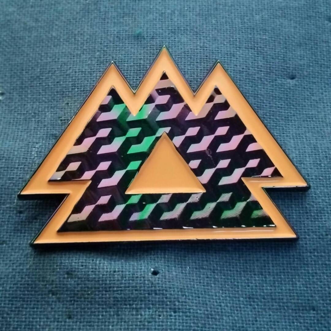 LE EDM Wakaan Anodized Raised Metal Logo Pin 1.5 Inch by 1.25 Inch ...