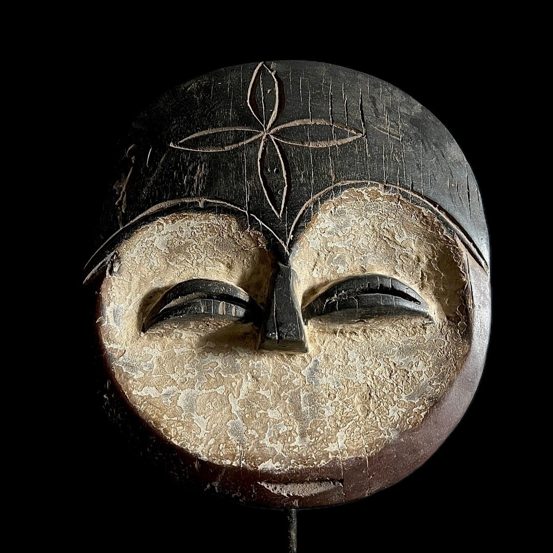 African Masks as Large African Masks Also Known as Hanging Lega Mask ...
