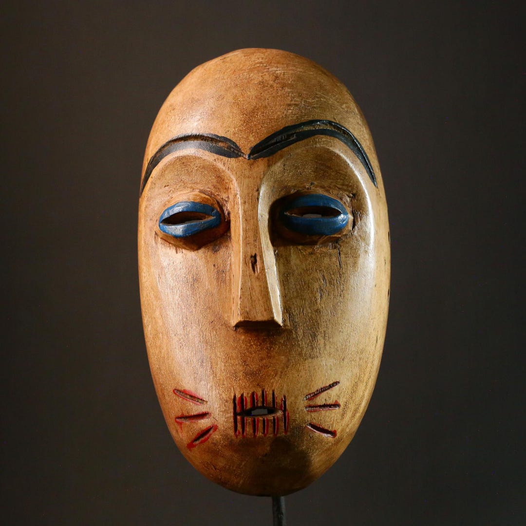 African Mask Lega Carving With Blue Eyes and Red Cheek Marks Light Wood ...
