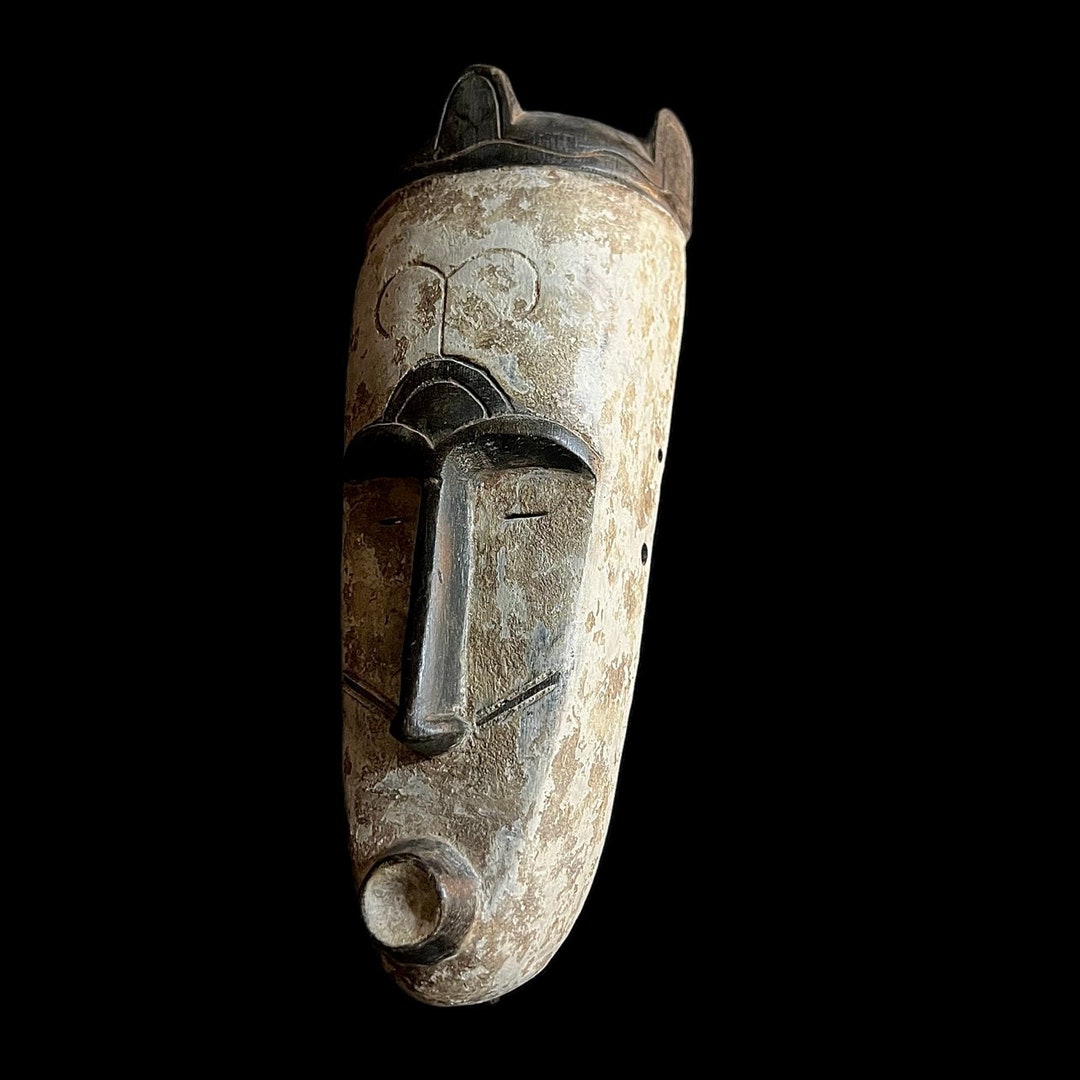 African Mask Fang Mask the Solemnity of Ngil Masks in the African Wall ...