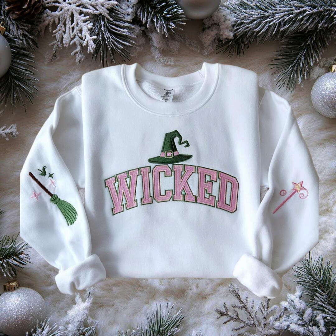 Wicked Defy Gravity Embroidered Sweatshirt, Witch Pink and Green ...