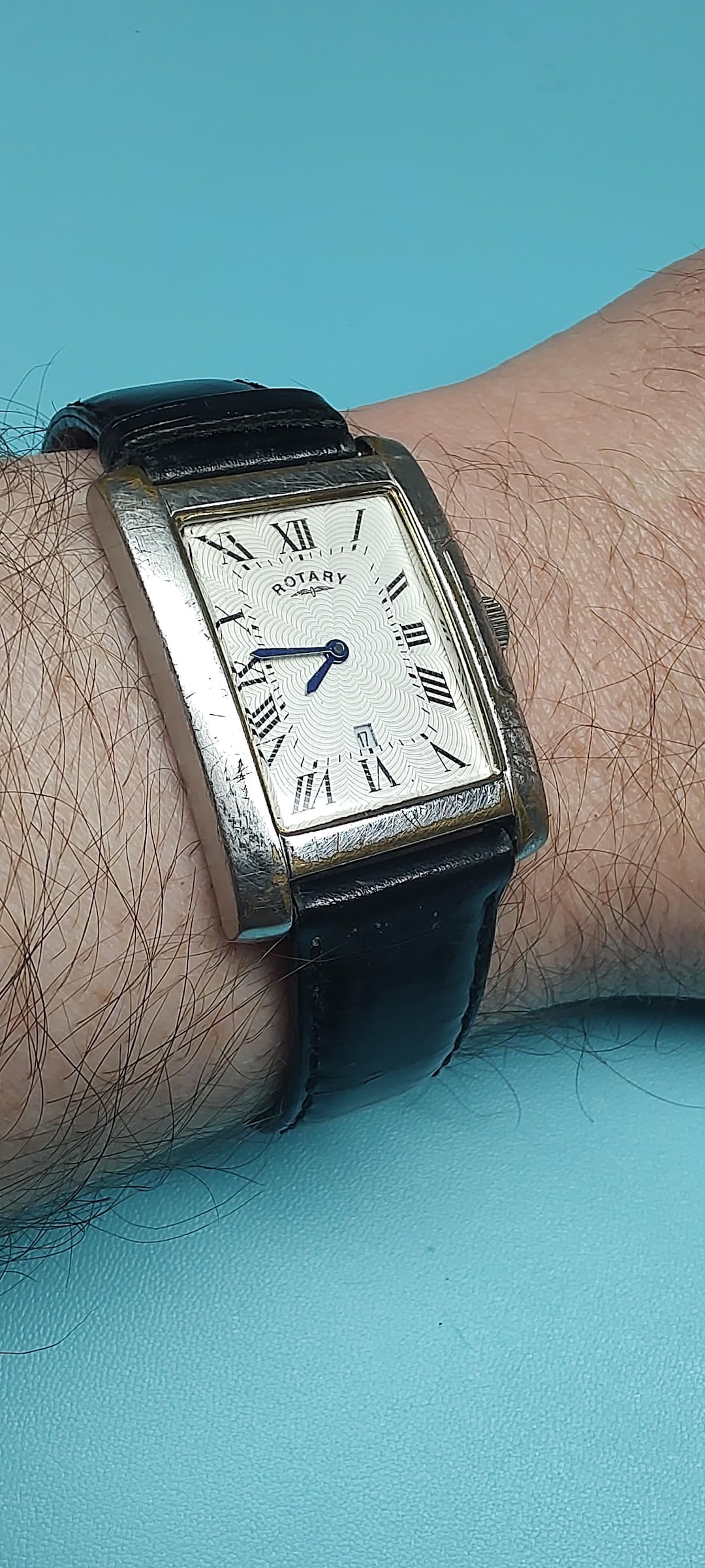 Rotary Tank Watch Guilloche Dial Blue Steel Hands Roman Numerals Date ...
