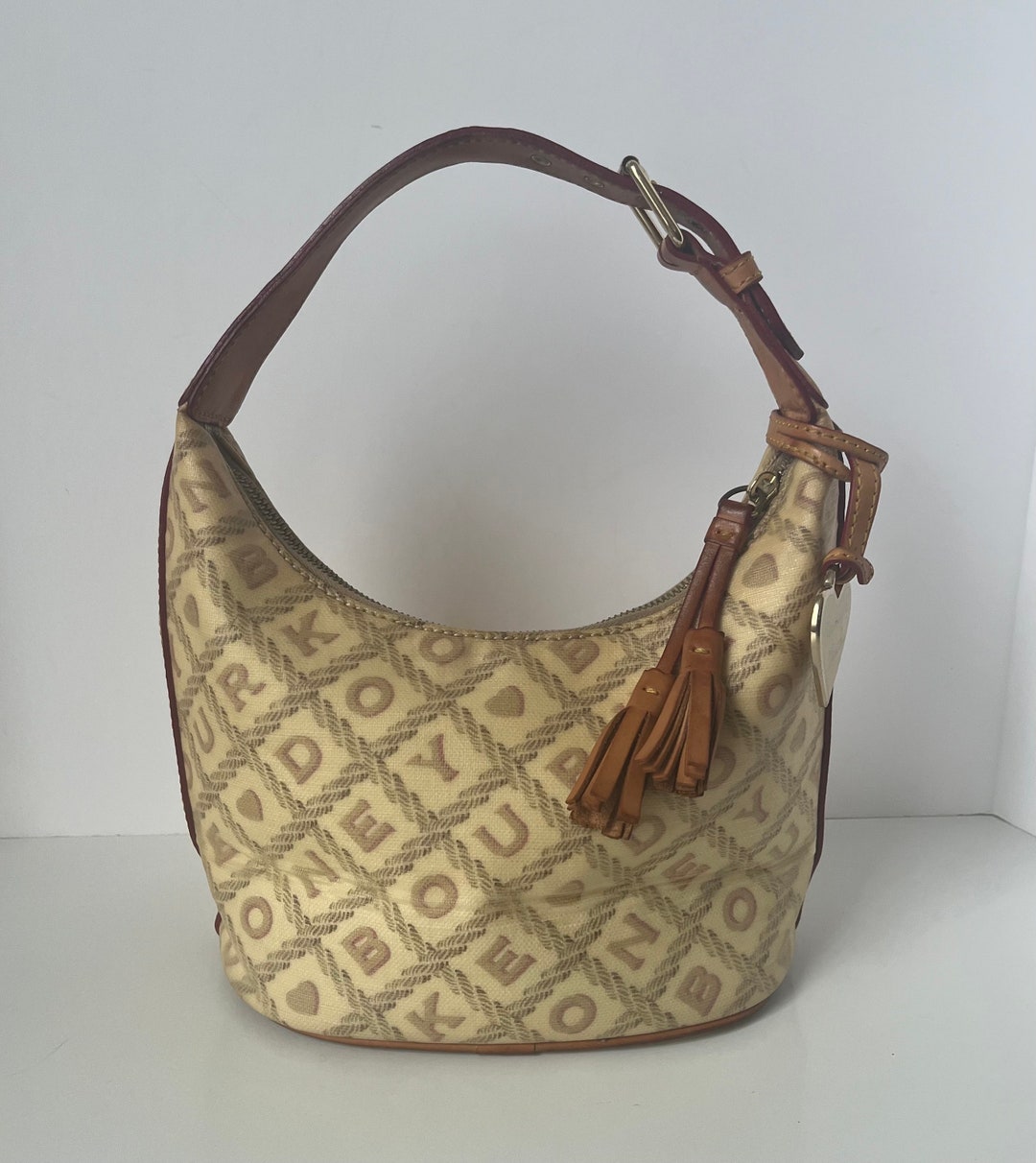 Dooney & Bourke Y2K “spellout” Small Bucket Bag - Etsy