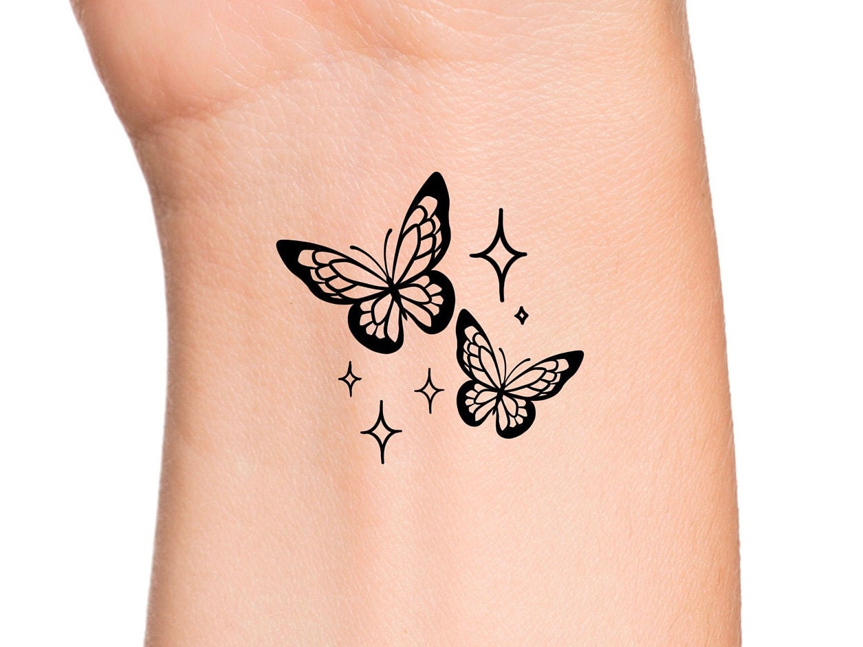 Butterfly And Star Tattoos On Shoulder