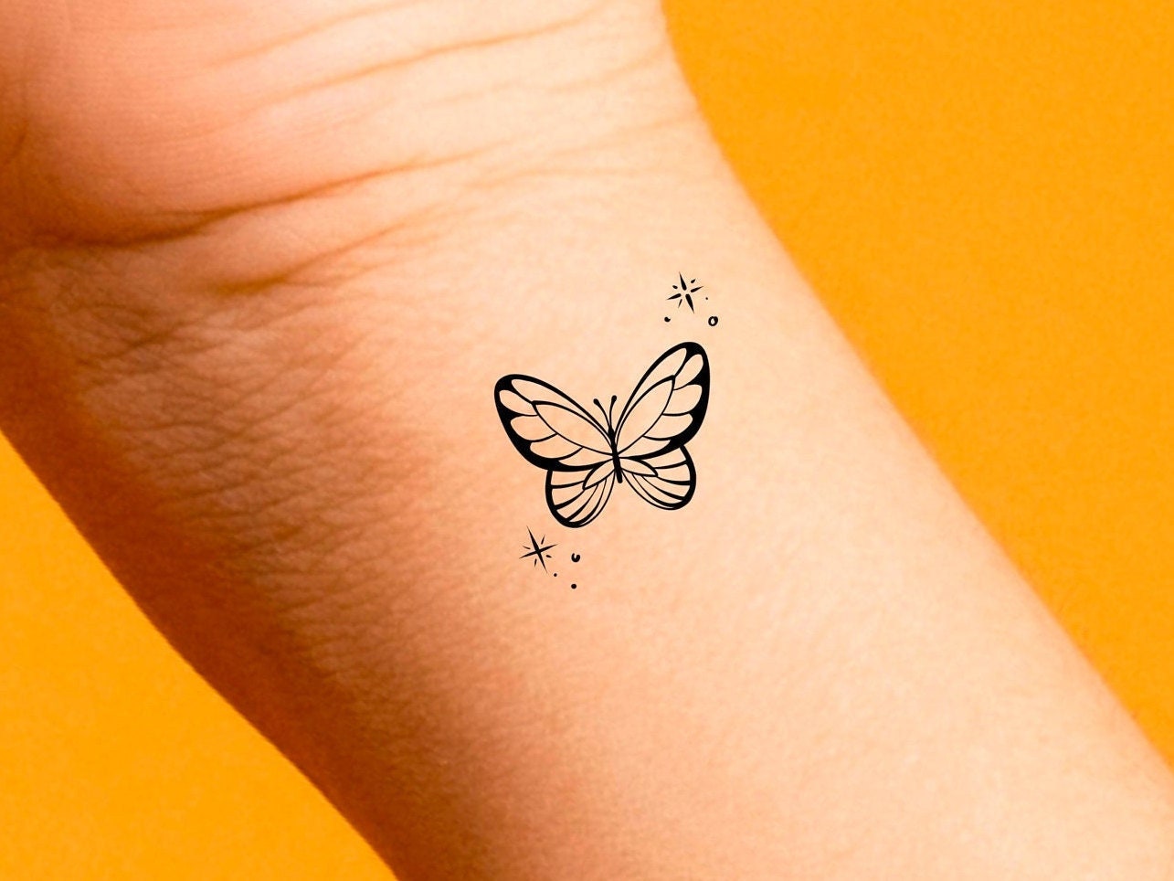 Butterfly And Star Tattoos On Shoulder