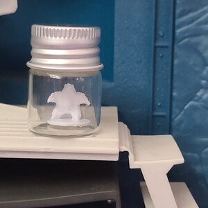 Batcave Trophy Room With Robin Memorial, Giant Penny, Penguin, and ...