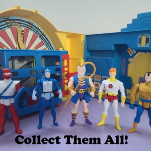 Batcave Trophy Room With Robin Memorial, Giant Penny, Penguin, and ...