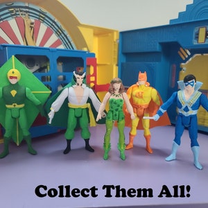 Batcave Trophy Room With Robin Memorial, Giant Penny, Penguin, and ...