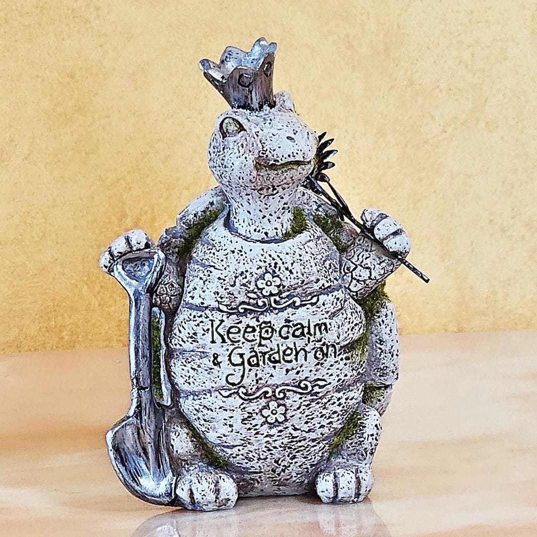 Turtle Figurine With Shovel and Flower Stem in Hand Captioned: "keep ...