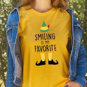 Smiling is My Favorite Elf Legs Hat Graphic T-shirt, Buddy the Elf ...