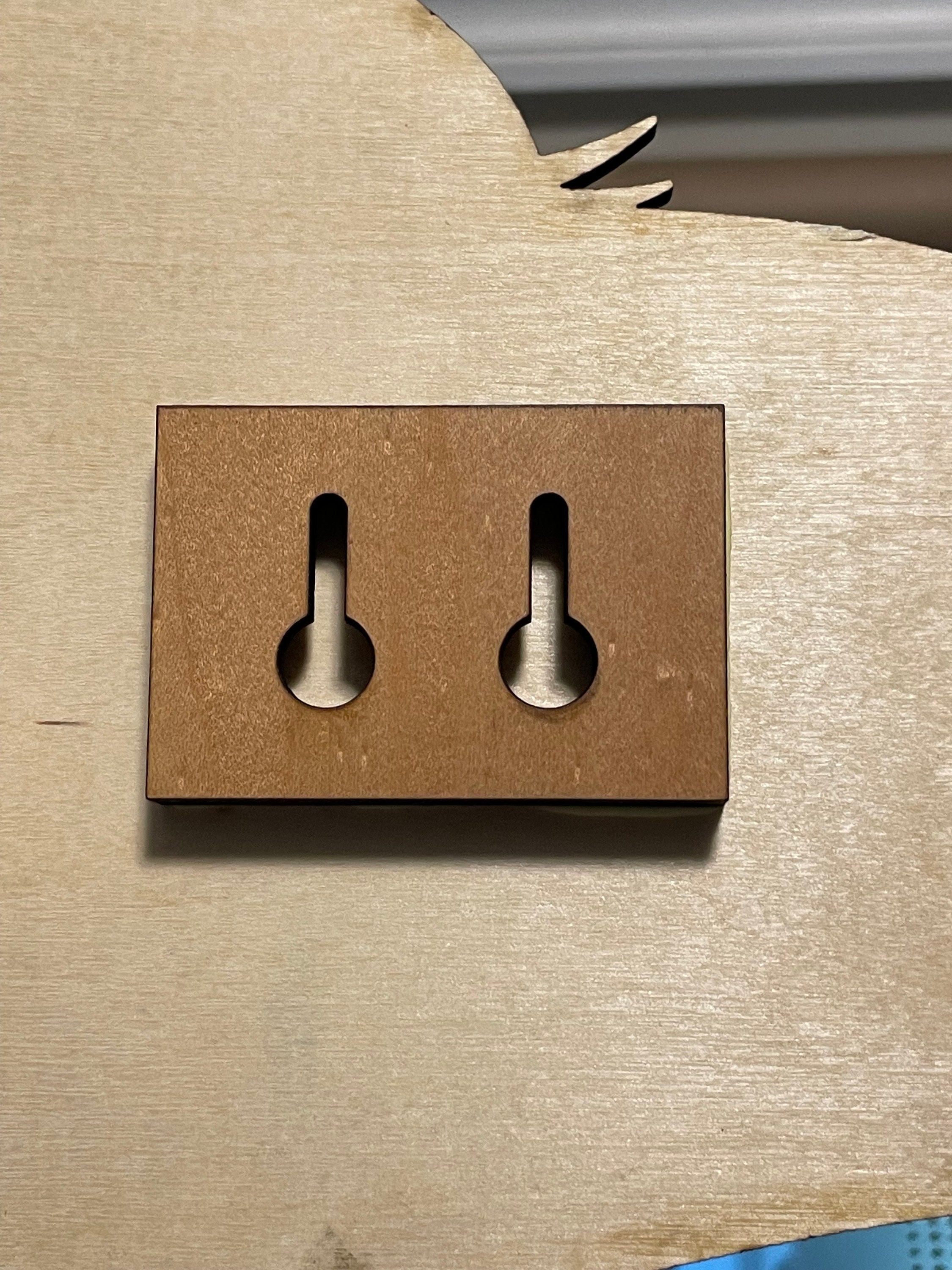 This Wall Hanging System Uses Keyholes and Screws for Easy and Secure ...