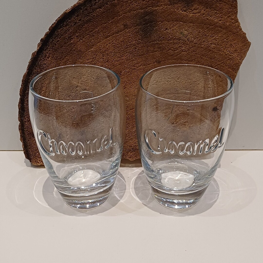 A Clear Chocomel Glass, With the Logo of the 'hand With the Glass of ...