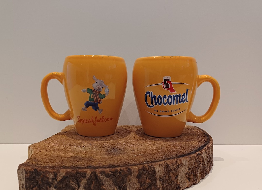 Chocomel - Efteling, Yellow Mug With an Image of One of the Goats From ...