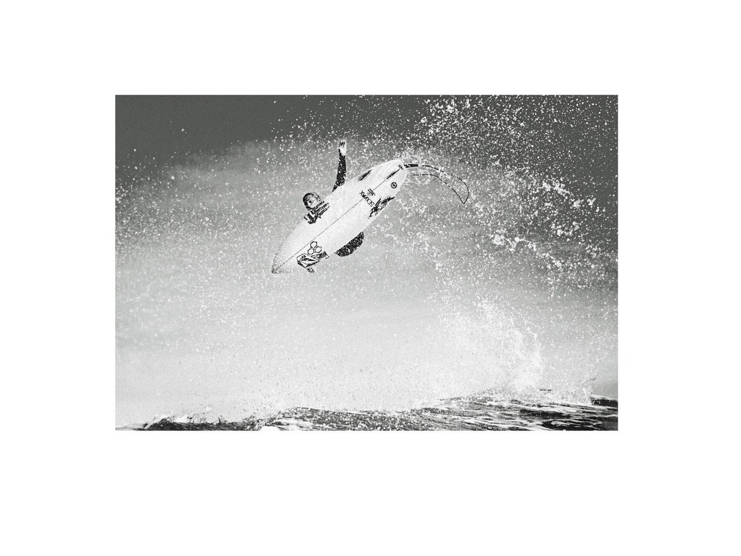 Photograph of a Surfer Flying Through the Air While Surfing in Hawaii ...