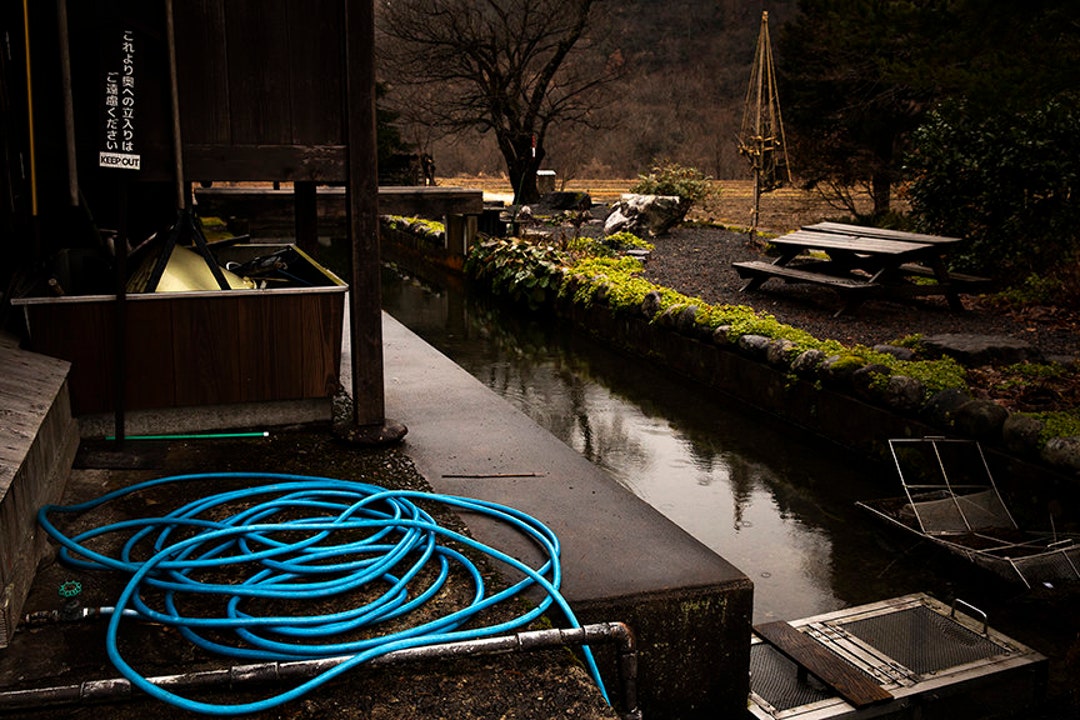 An Uncoiled Garden Hose is Left Out by Japanese Home in Winter | Photo ...