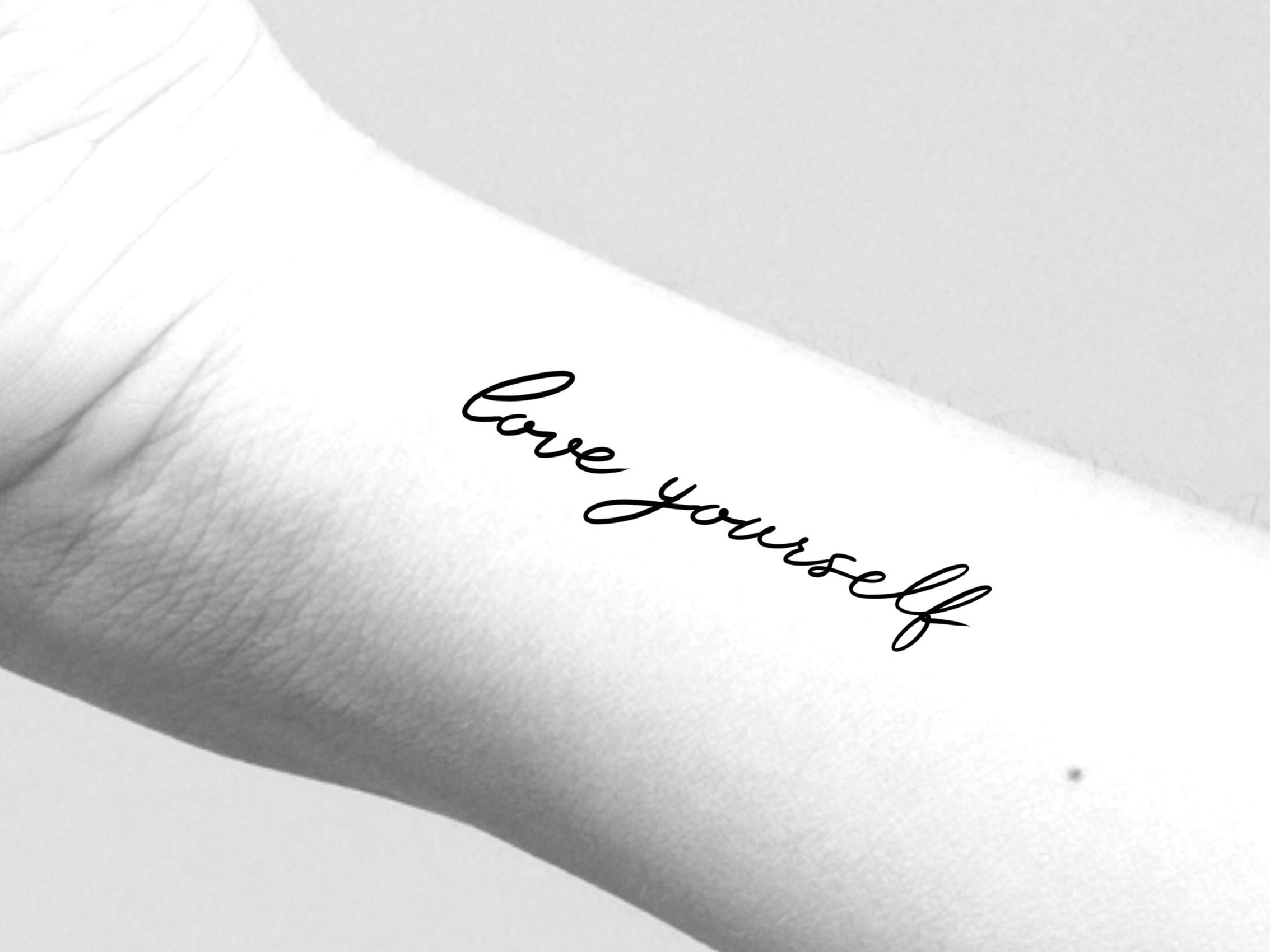 Love Yourself Finger Tattoo