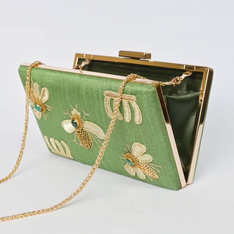 Bee-utiful Opulence: Green Silk Hand Clutch With Bee Pattern and Onyx ...