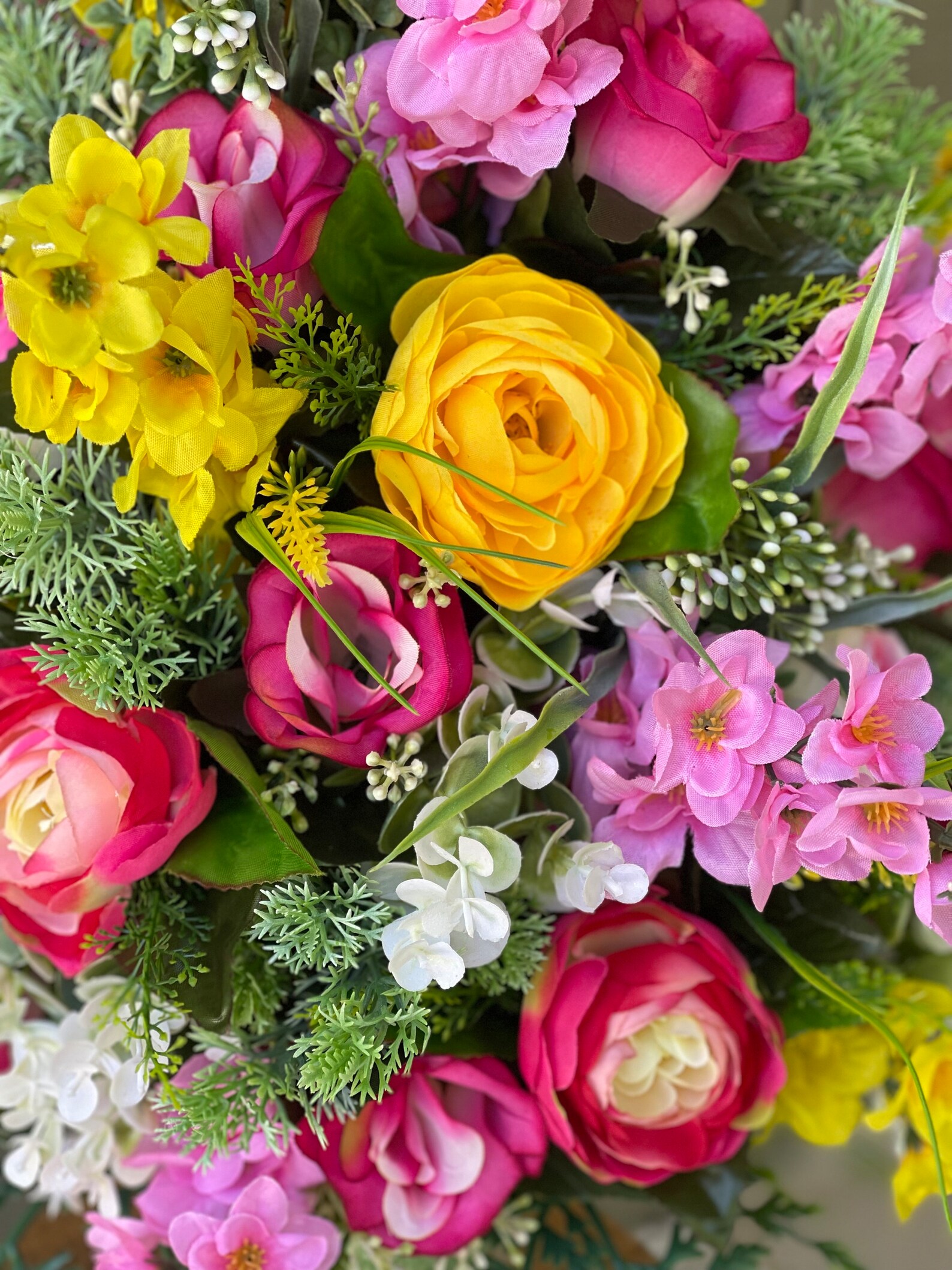 Pink and Yellow. Ranunculus, and Roses Grave Flower Arrangement ...