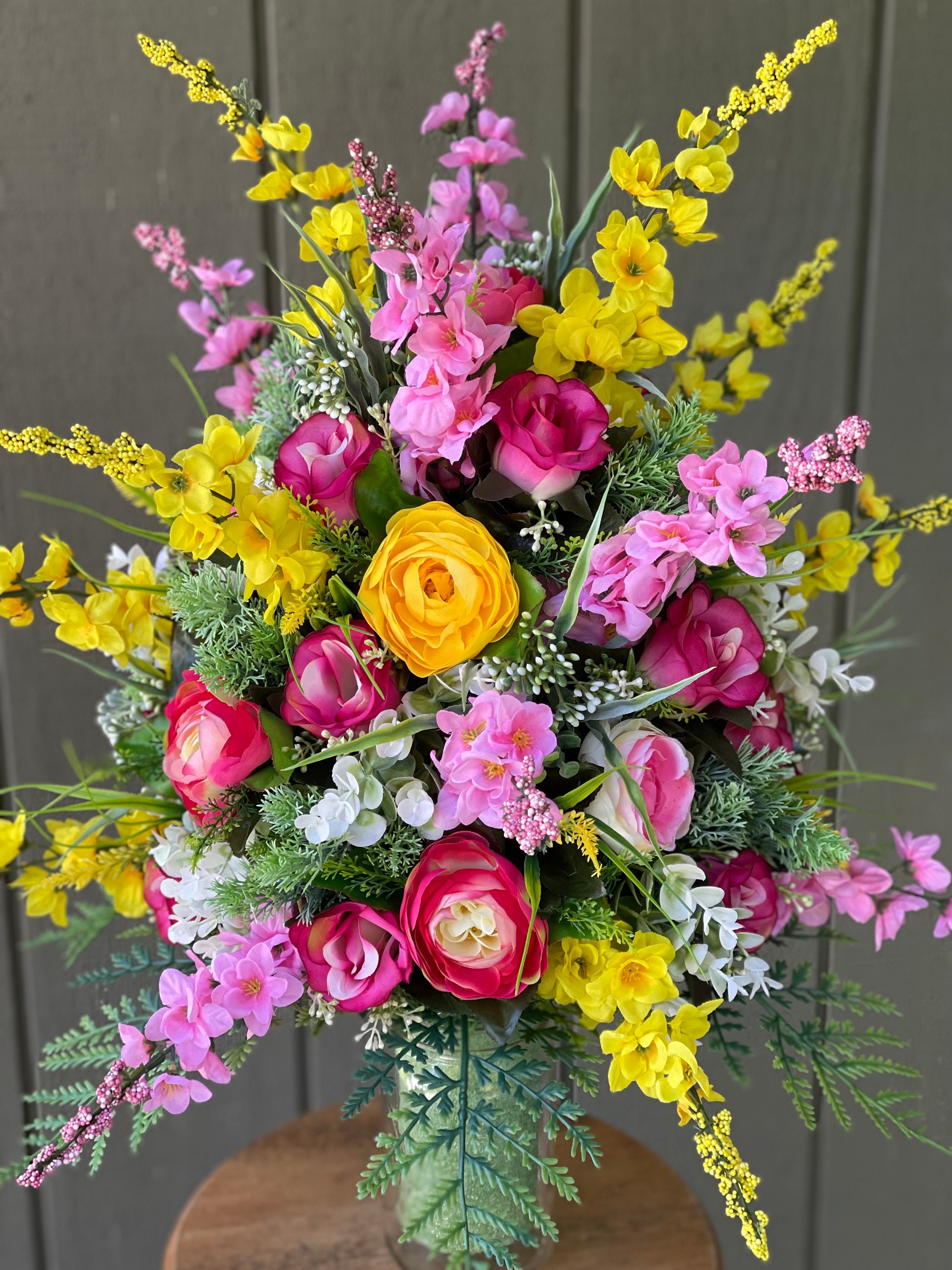 Pink and Yellow. Ranunculus, and Roses Grave Flower Arrangement ...