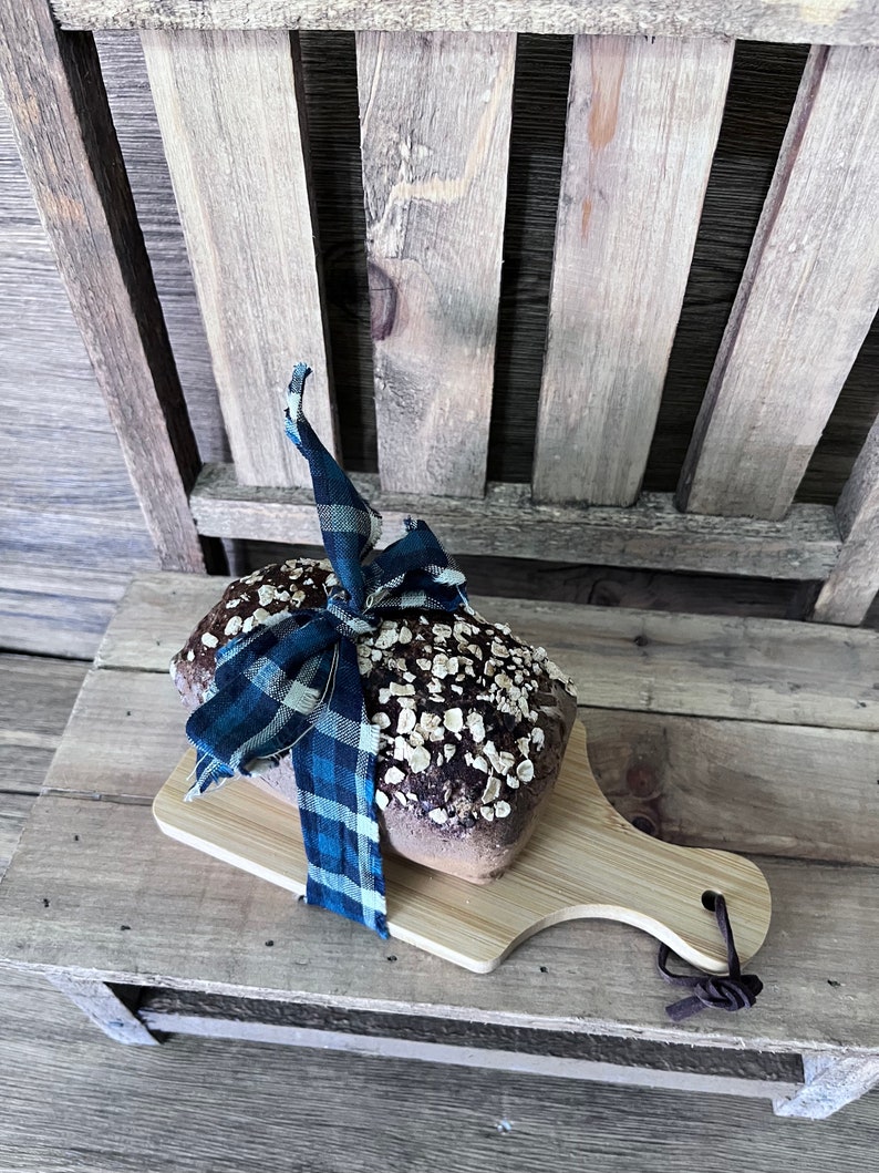 Faux Bread Loaves With Oatmeal Topping on Cutting Board or in Baking ...