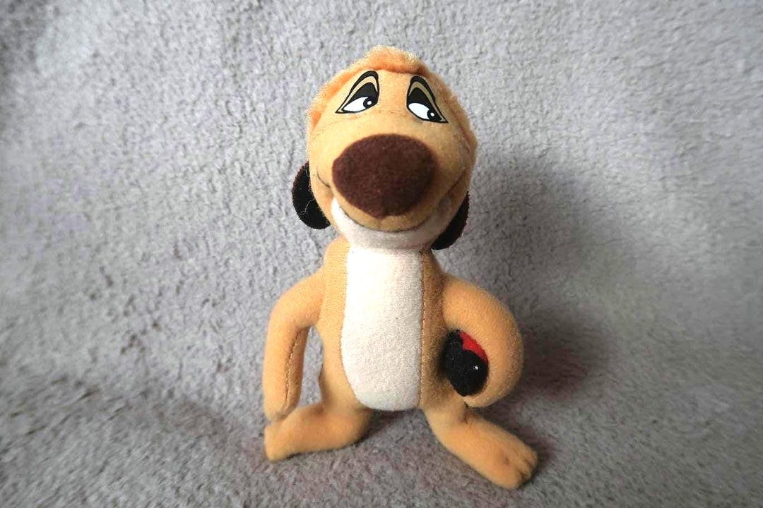 Meerkat Timon Holding a Ladybug in Hand. Rare Collectible Toy. Official ...