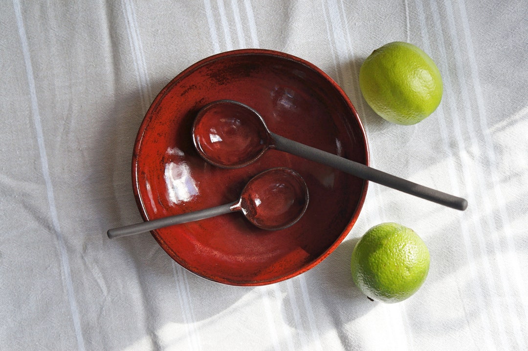 Cinnabar Red Ceramic Bowl With a Serving Spoon, Black Stoneware Side ...