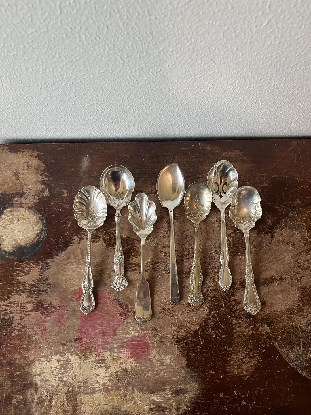 Six Fancy Silverplate Sugar Spoons One Fancy Aspic Spoon Various ...