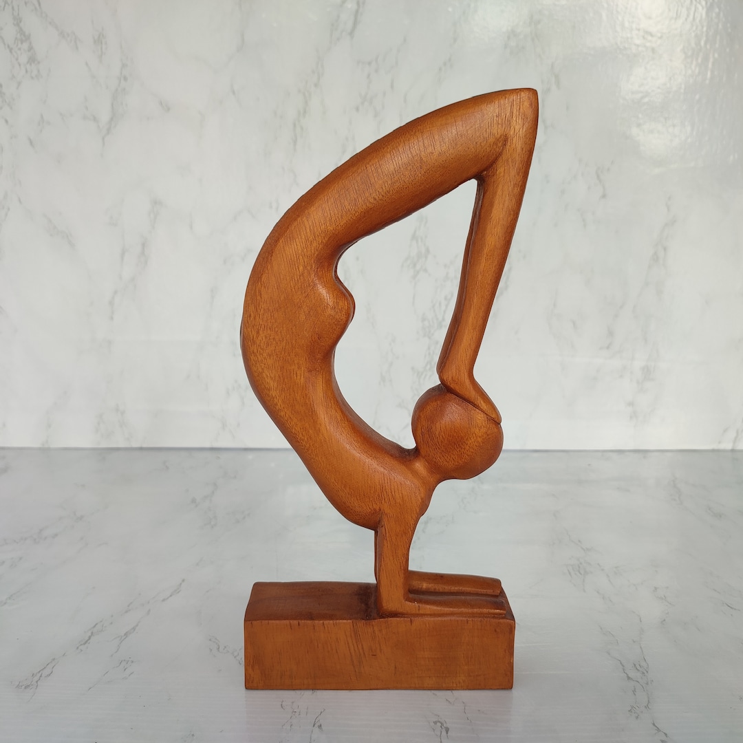 Statue of a Woman Doing Flexibility Exercises. Yoga Athletic Exercise ...