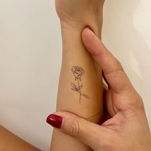 tiny flower wrist tattoos
