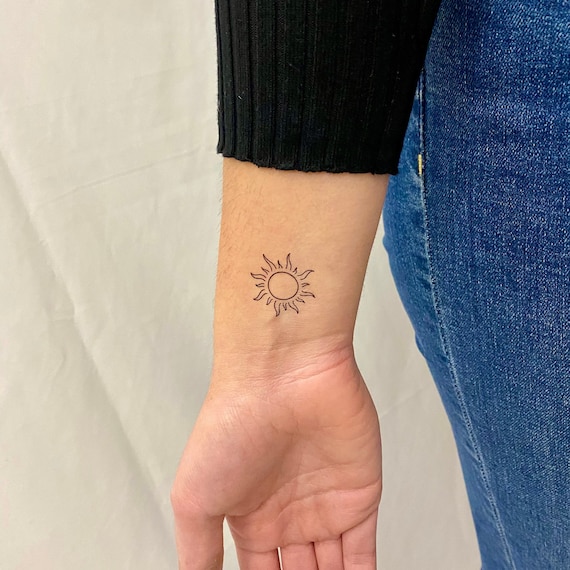 Simple Sun Tattoo Wrist