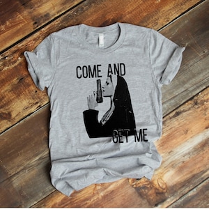 Ambiguous Shirt, Sexy Nun Licks the Gun Tee Shirt , Sexy Nun T Shirt ...